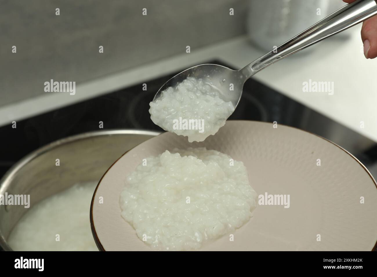 Woman putting plate rice hi-res stock photography and images - Alamy