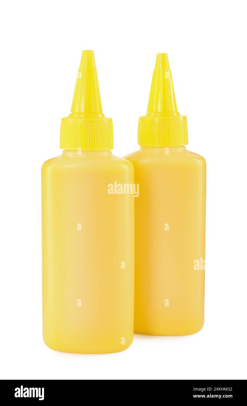 Bottles of yellow printer ink isolated on white Stock Photo - Alamy