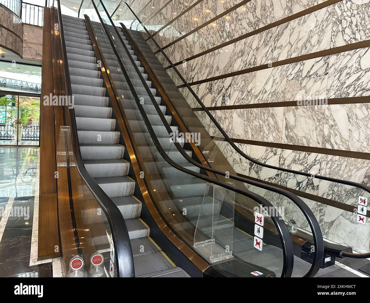 Modern escalators with handrails in shopping mall Stock Photo - Alamy