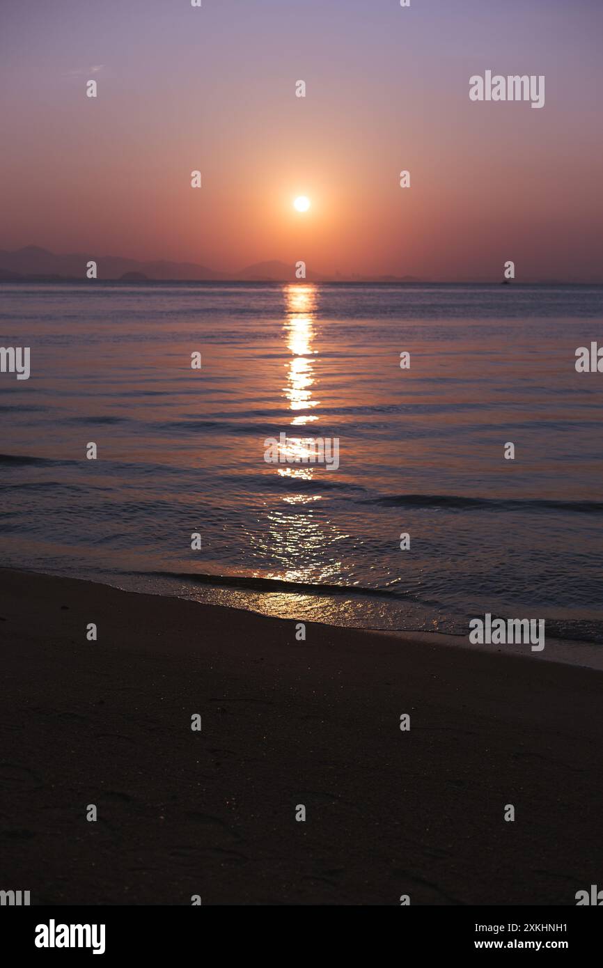 Sunset on the beach in Huizhou China Stock Photo - Alamy