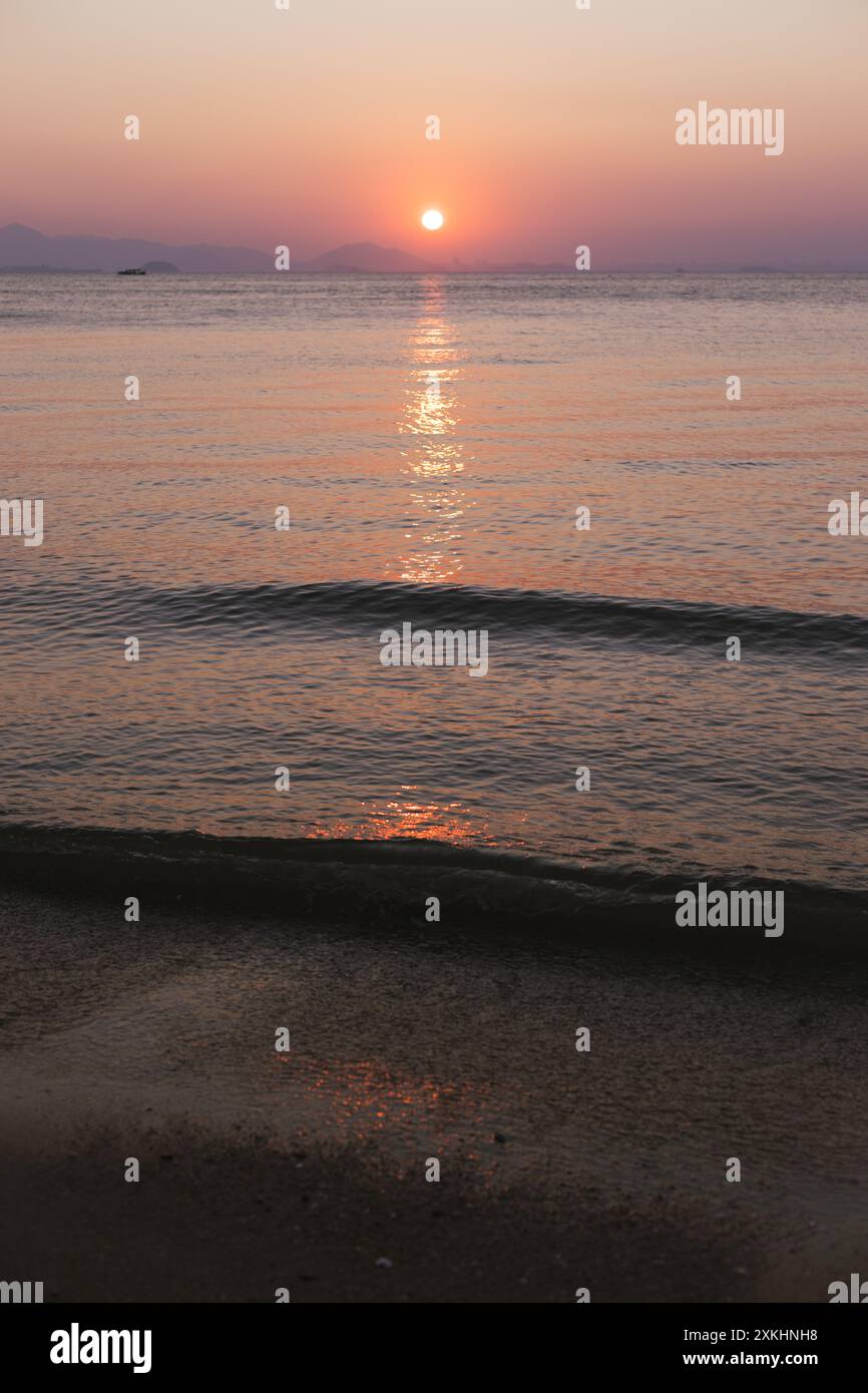 Sunset on the beach in Huizhou China Stock Photo - Alamy