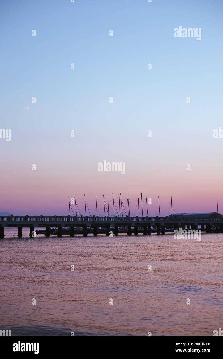 Seascape with sunset simple background Stock Photo - Alamy