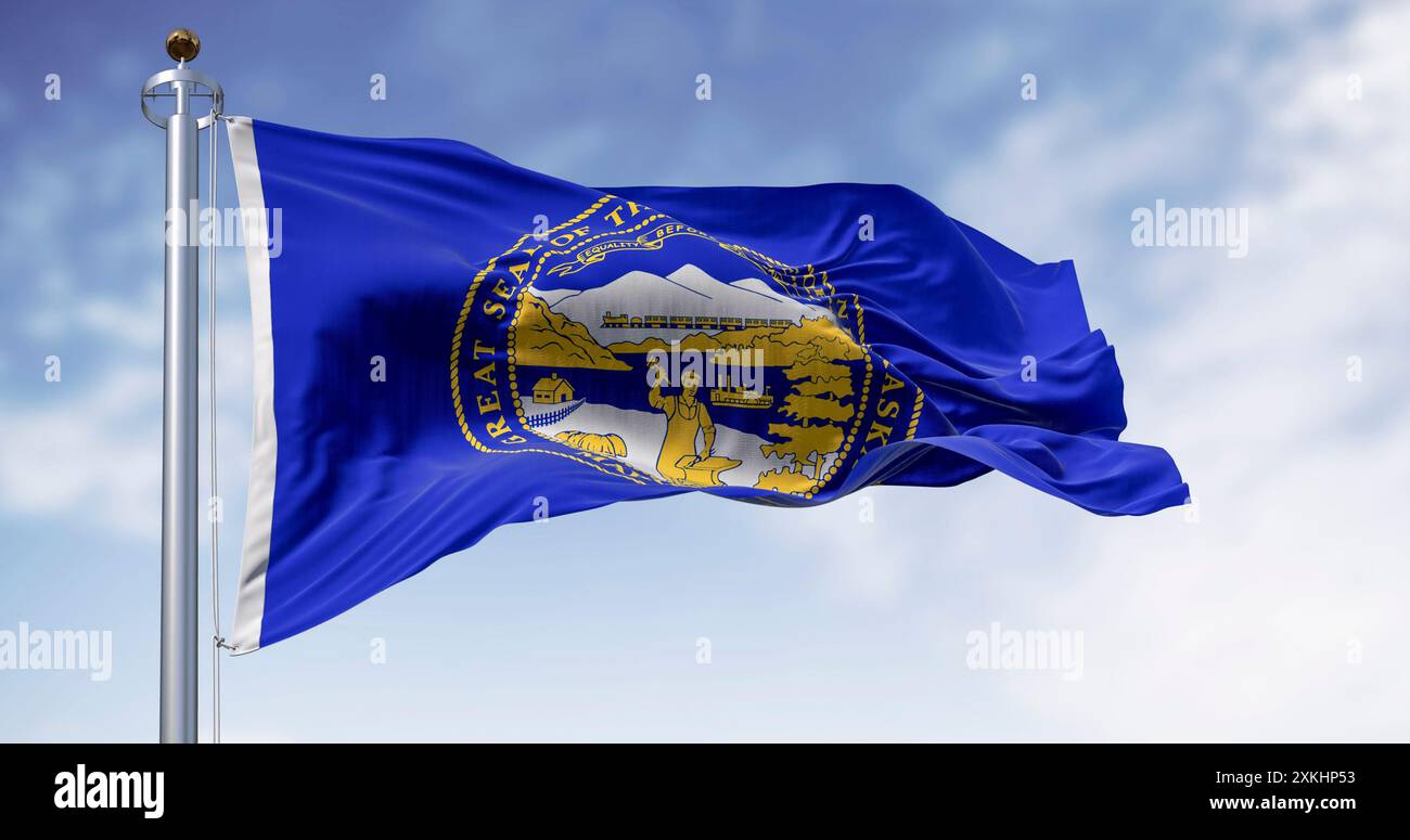 Nebraska state flag waving in the wind on a clear day. Blue with the ...
