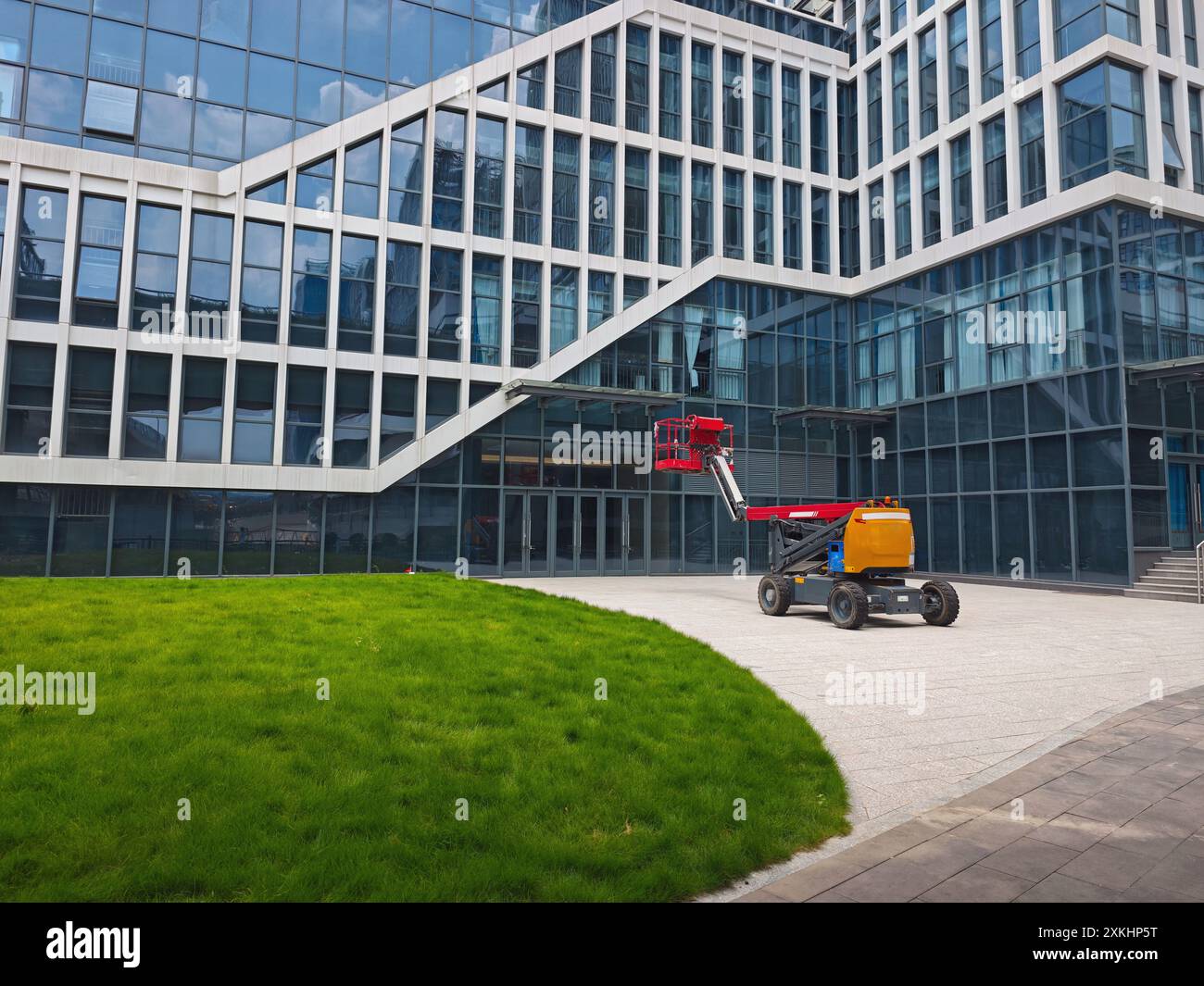 Lift truck with modern building Stock Photo - Alamy