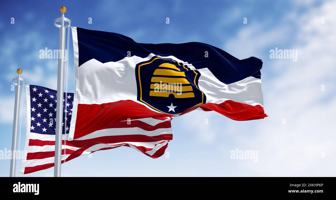 The Beehive Flag of Utah and the american flag waving on a clear day ...