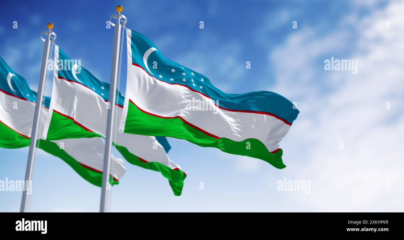 Three national flags of Uzbekistan waving on a clear day. Sovereign ...
