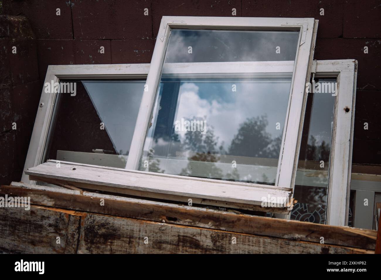 Construction waste for disposal. Heap of old wooden window frames with ...