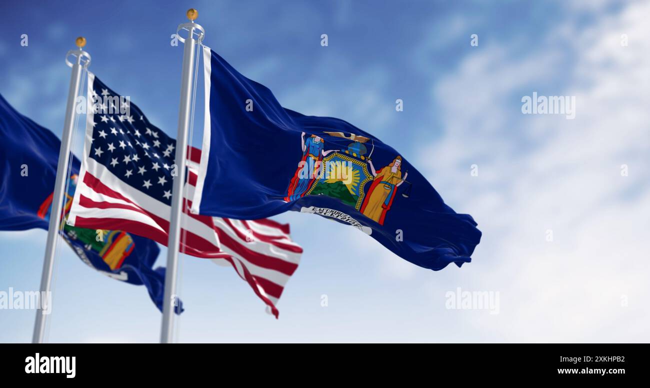 New York State flags waving with the American flag on a clear day. Blue ...