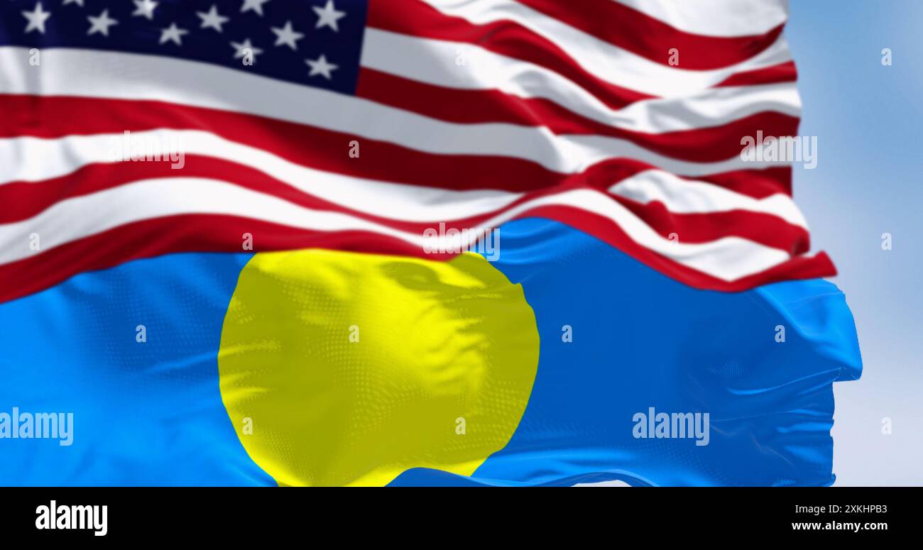 Close-up of Palau and american national flags waving in the wind ...