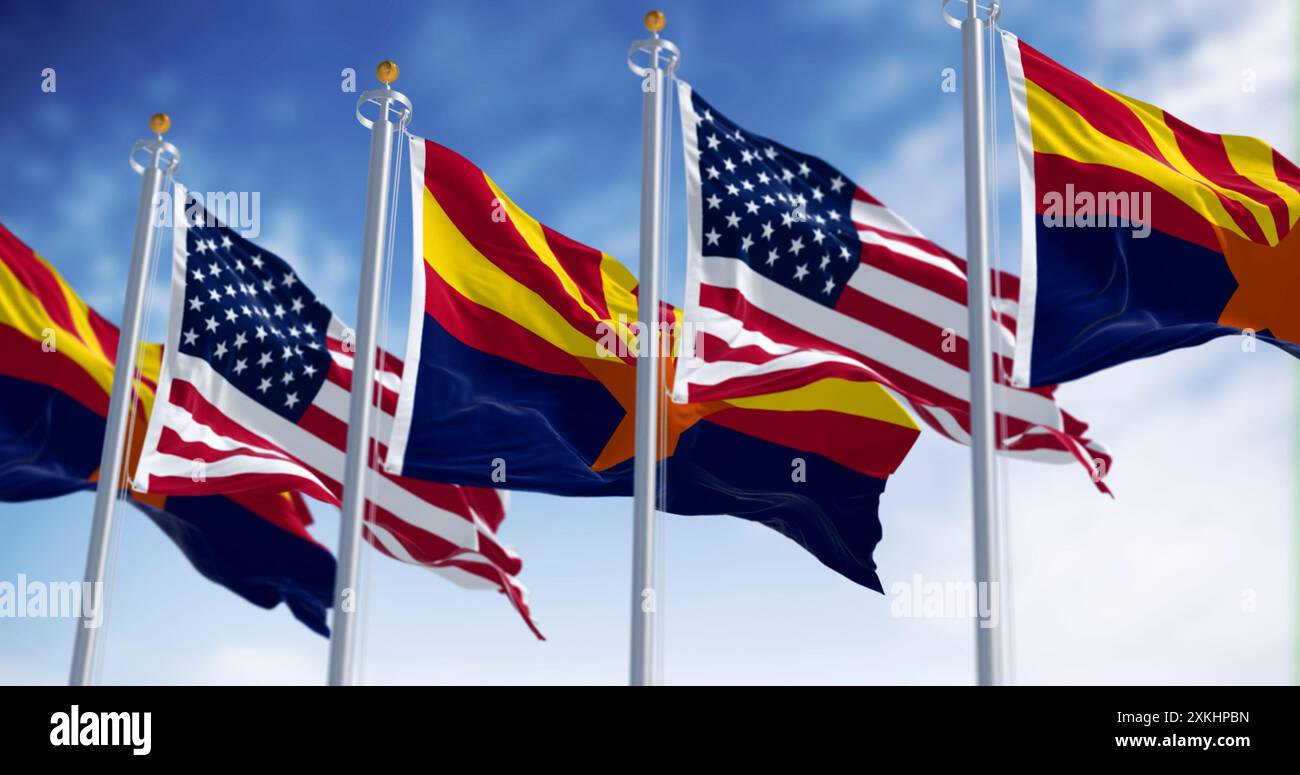 Flags of Arizona and United States waving in the wind on a clear day ...