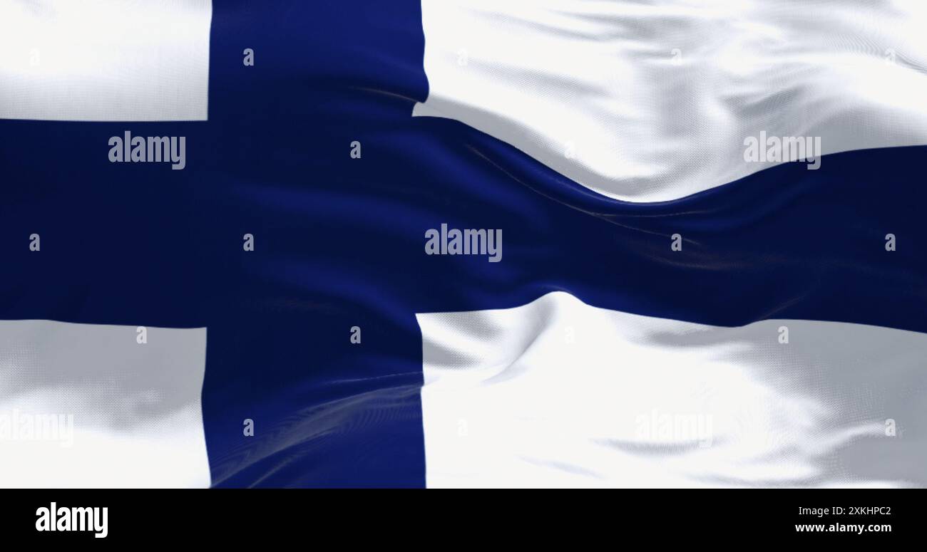 Close-up of national flag of Finland waving in the wind. Blue Nordic ...