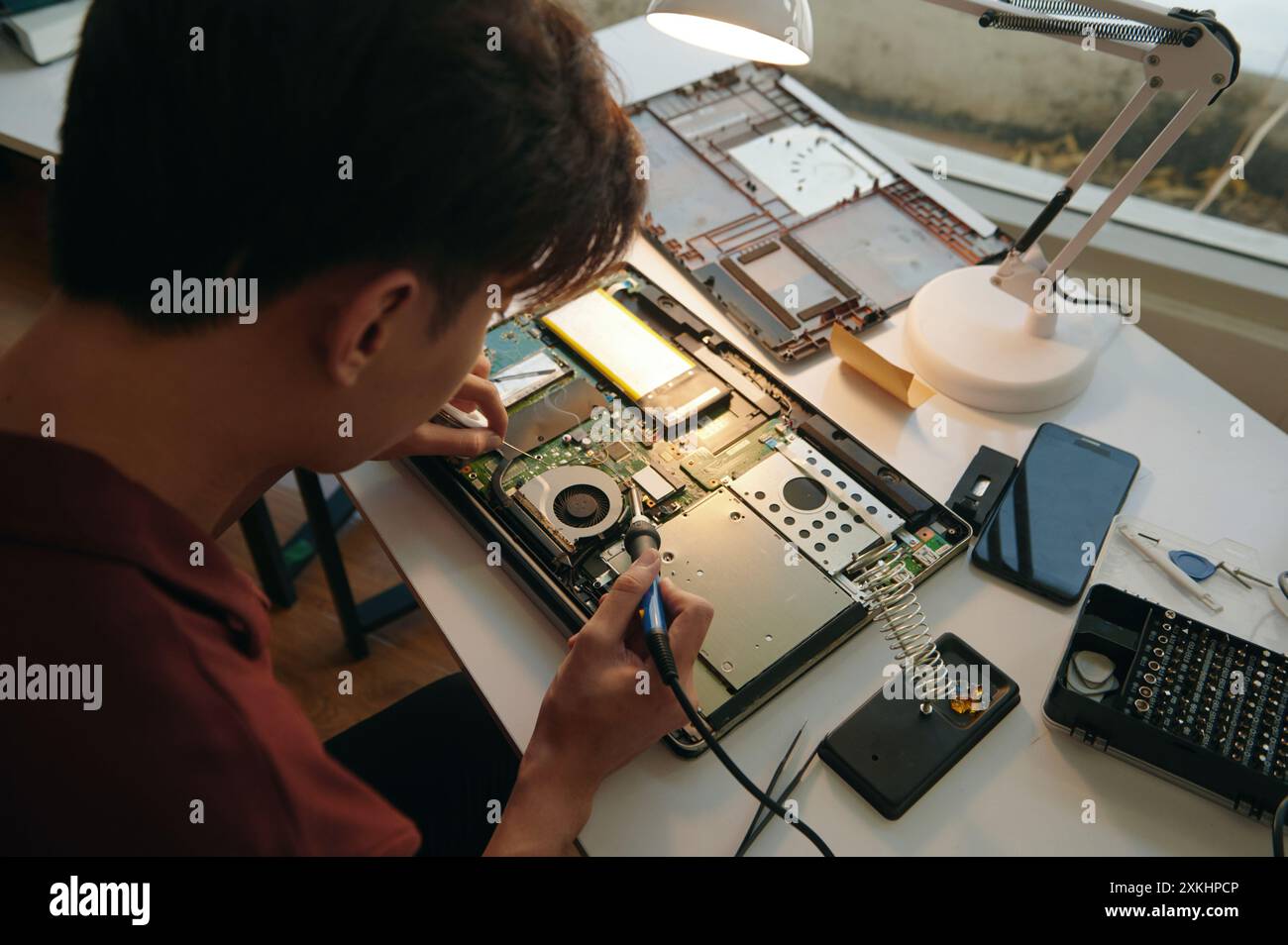 Technician Soldering The Board Of Computer Stock Photo - Alamy