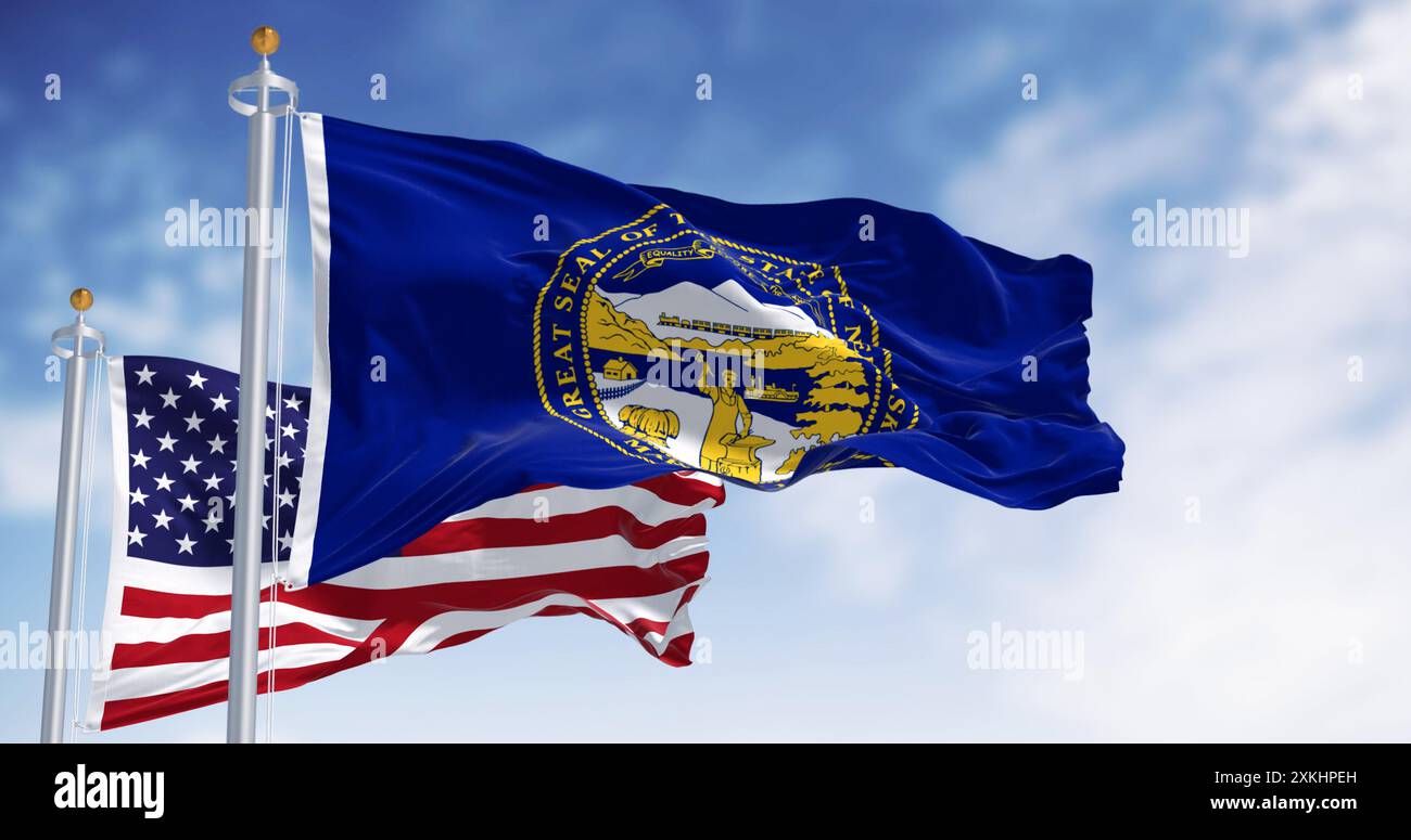Nebraska state flag waving with the American flag in background on a ...