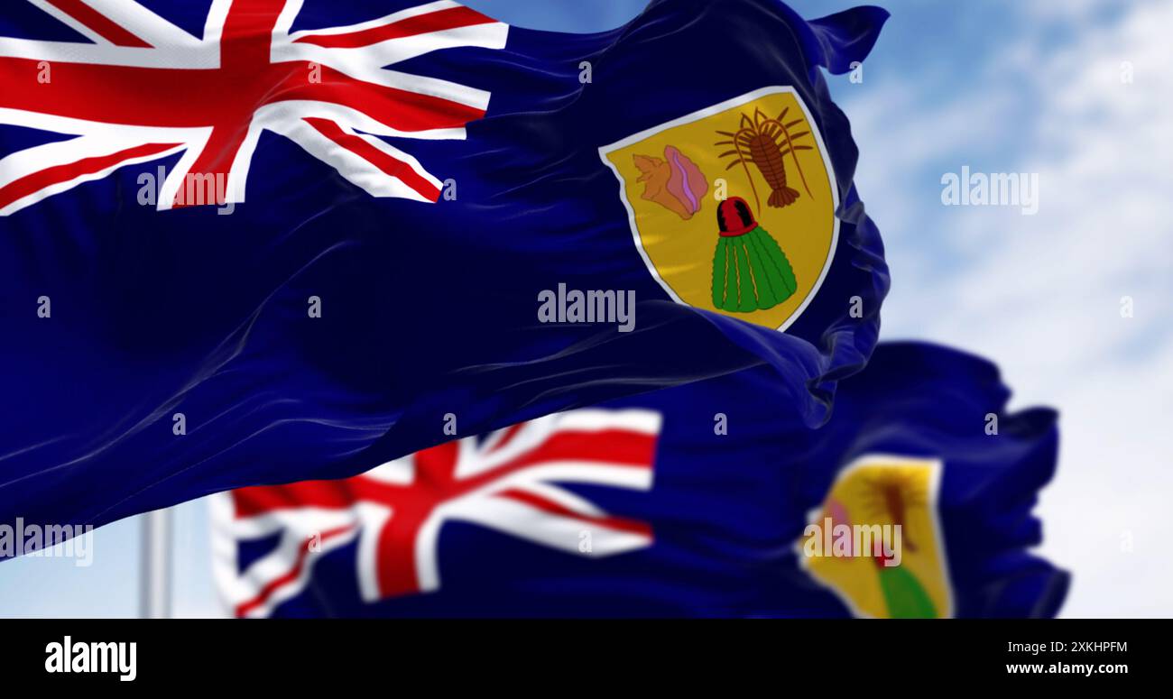 Flags of Turks and Caicos Islands waving in the wind on a clear day ...
