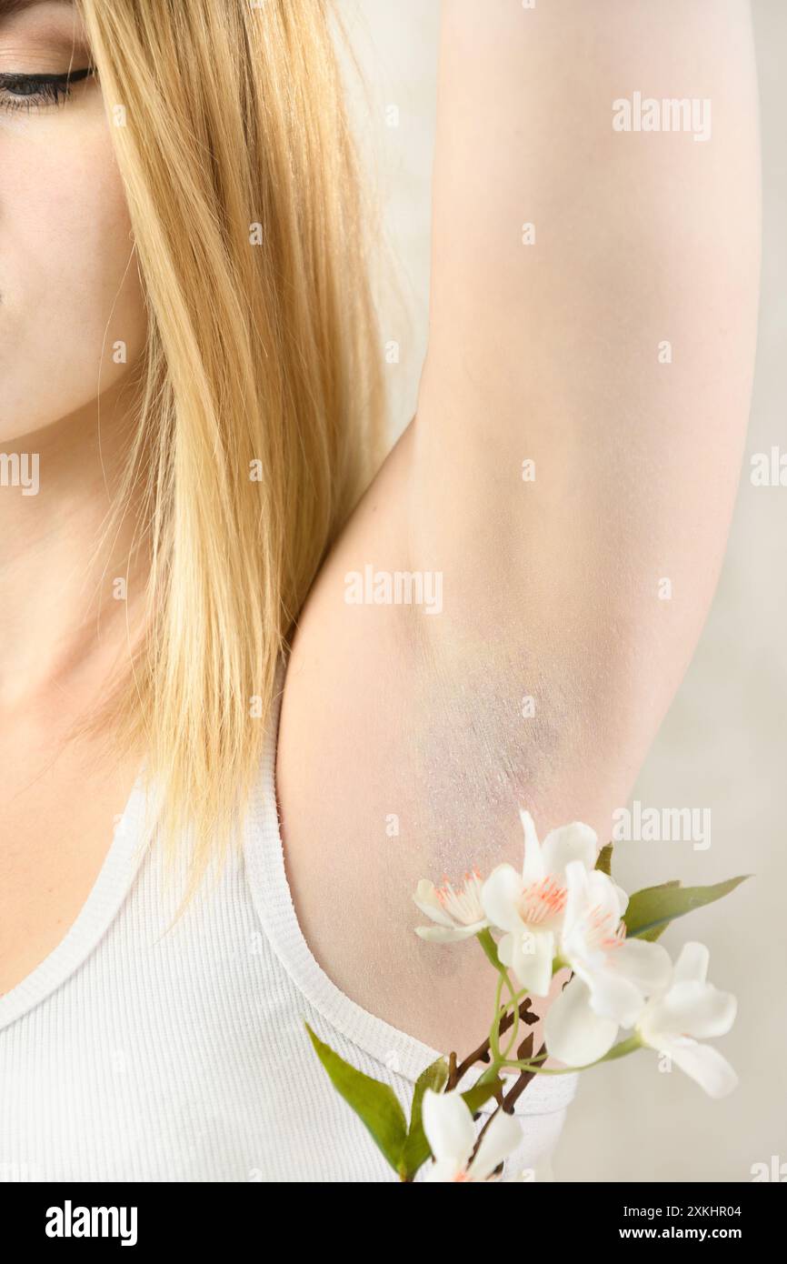 Woman showing armpit with talcum powder without hair after electro ...