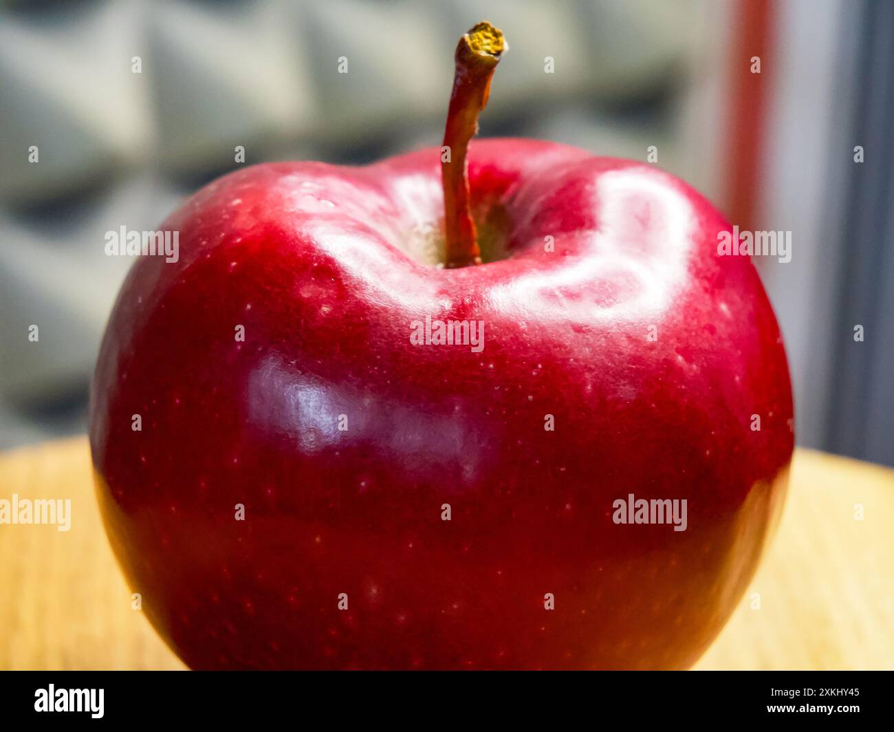 Moist surface of ripe red apple against subdued backdrop Stock Photo ...