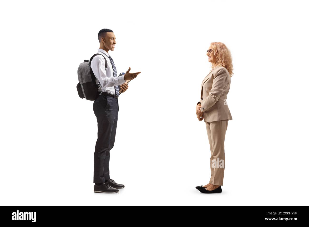 College boy having a conversation with a woman isolated on white ...