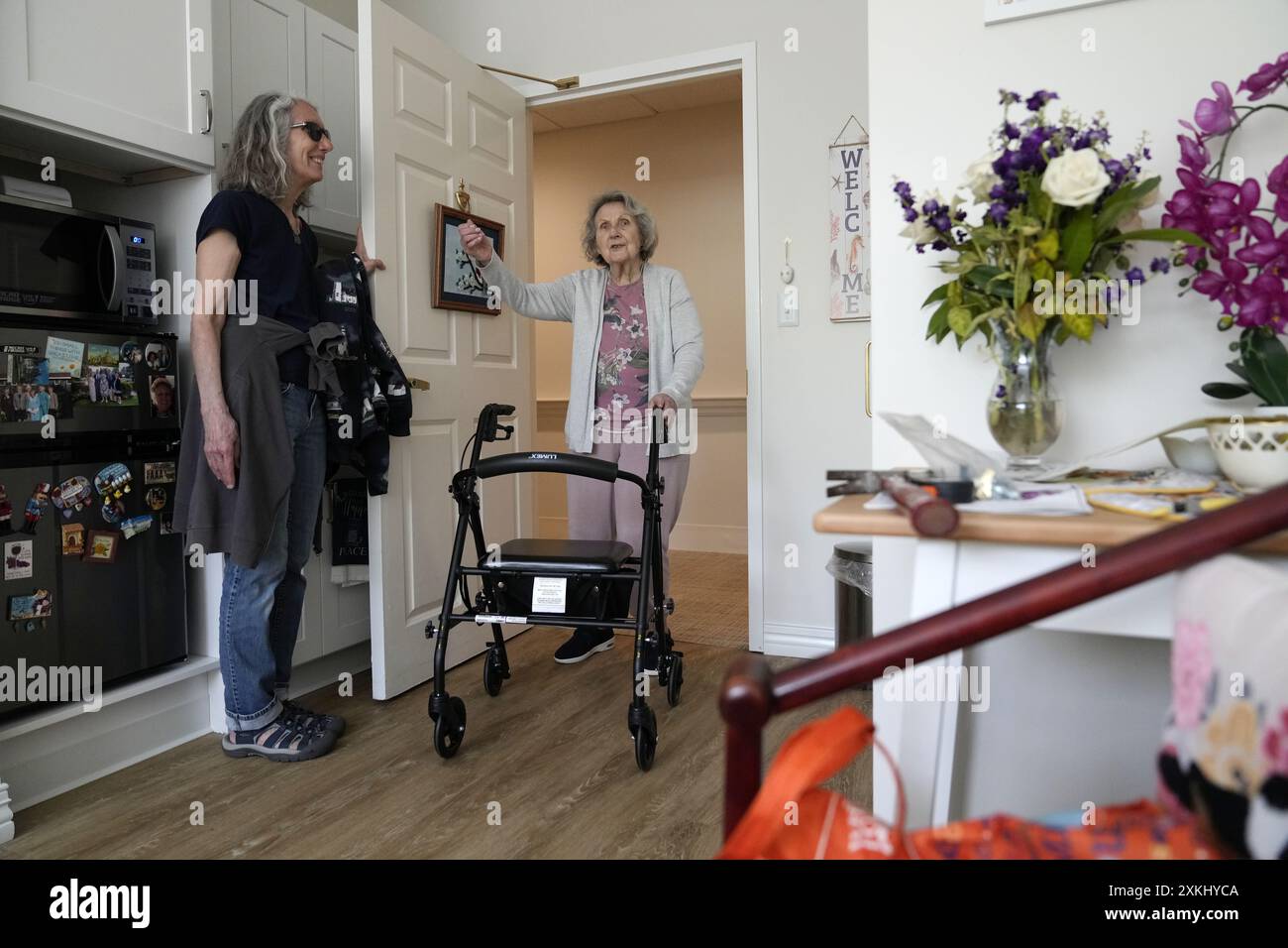 A 95 year-old woman in her apartment in an assisted living facility ...