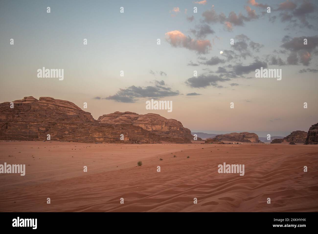 Evening Landscape of Wadi Rum with Rock Formation, Moon and Sand in ...