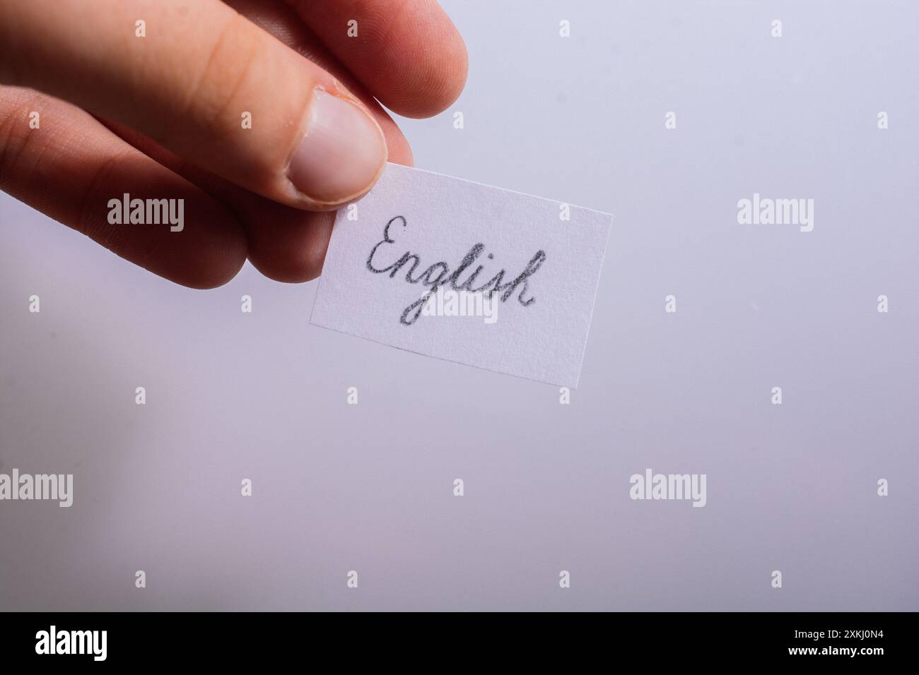 Hand holding notepaper with English wording on white background Stock ...