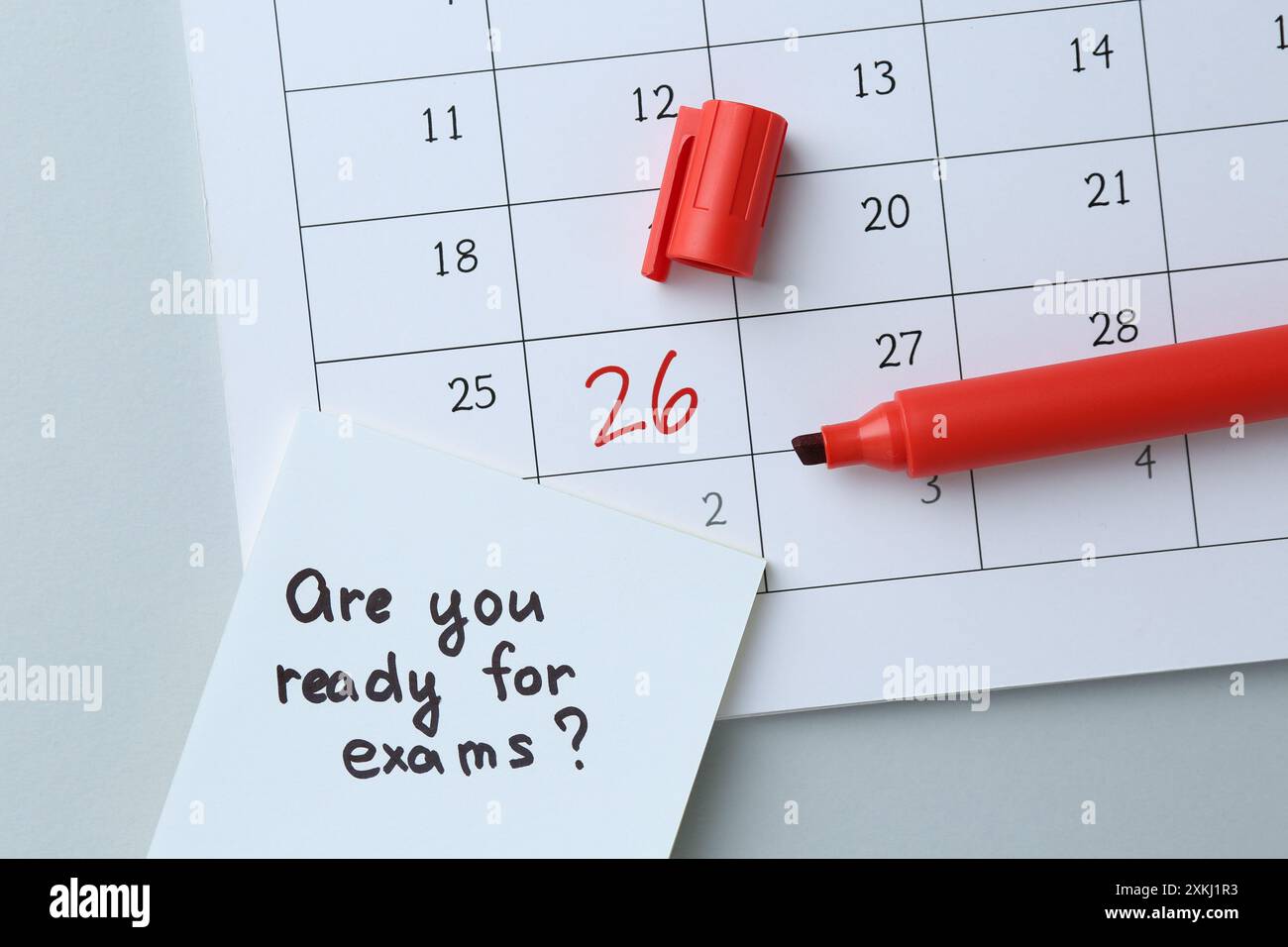 Paper note with question Are You Ready For Exams and stationery on grey ...