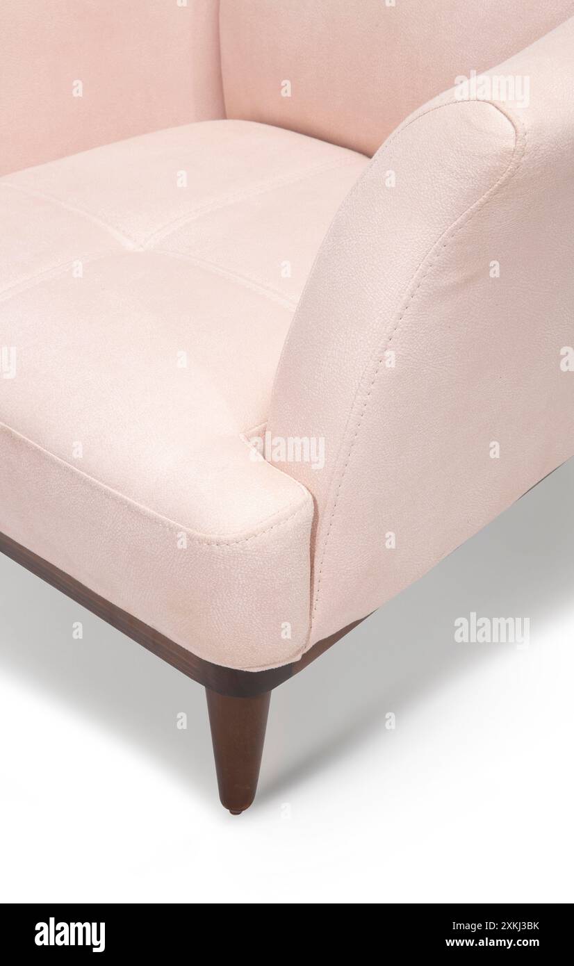 Elegant pastel pink armchair with wooden legs, perfect for modern ...