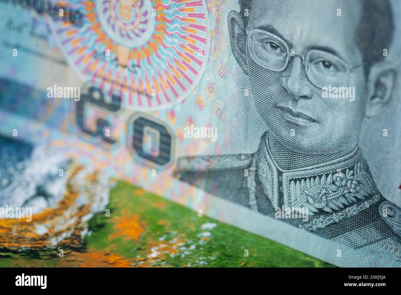 Thailand money, 20 Thai baht banknote against the background of the ...