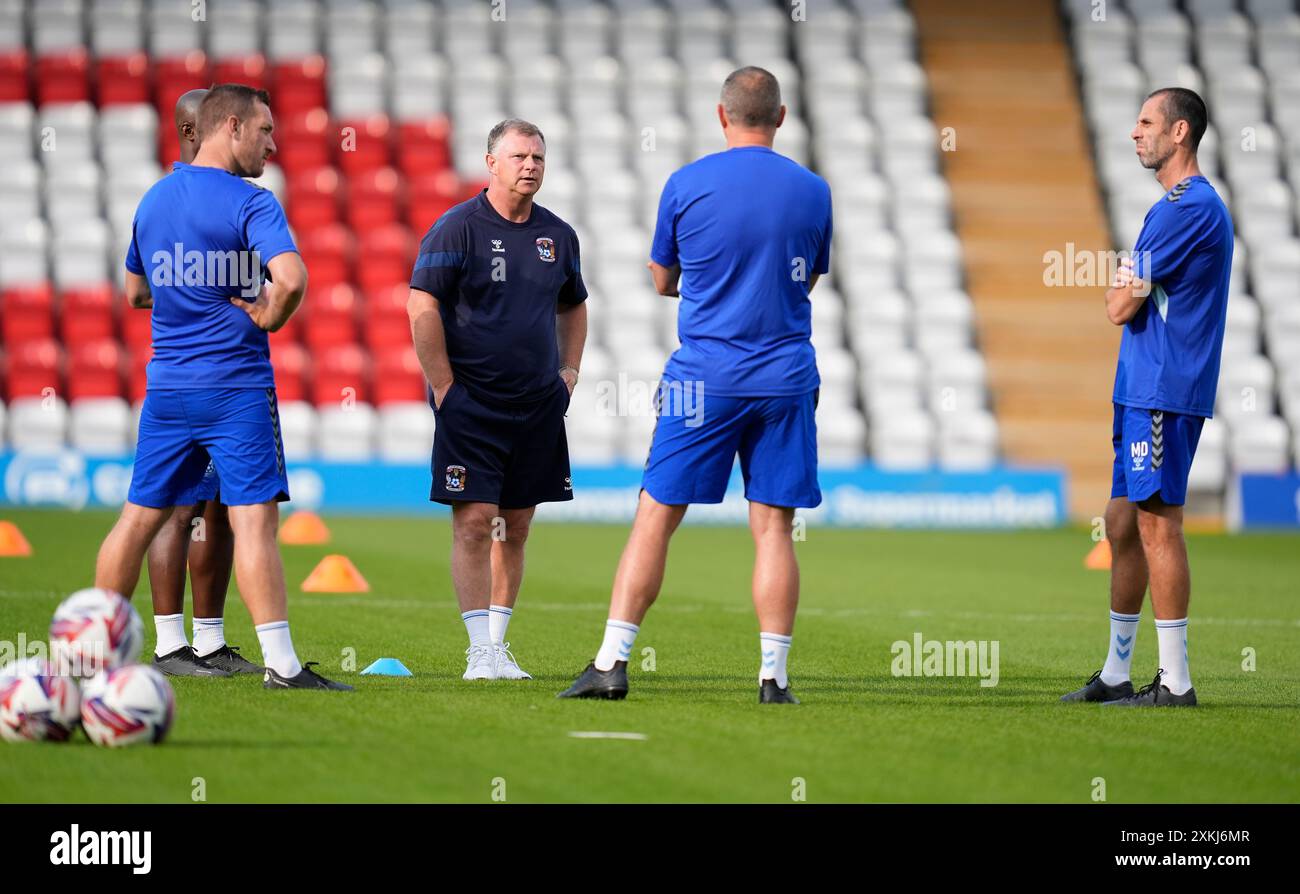 Coventry City manager Mark Robins (second left) before the pre-season ...