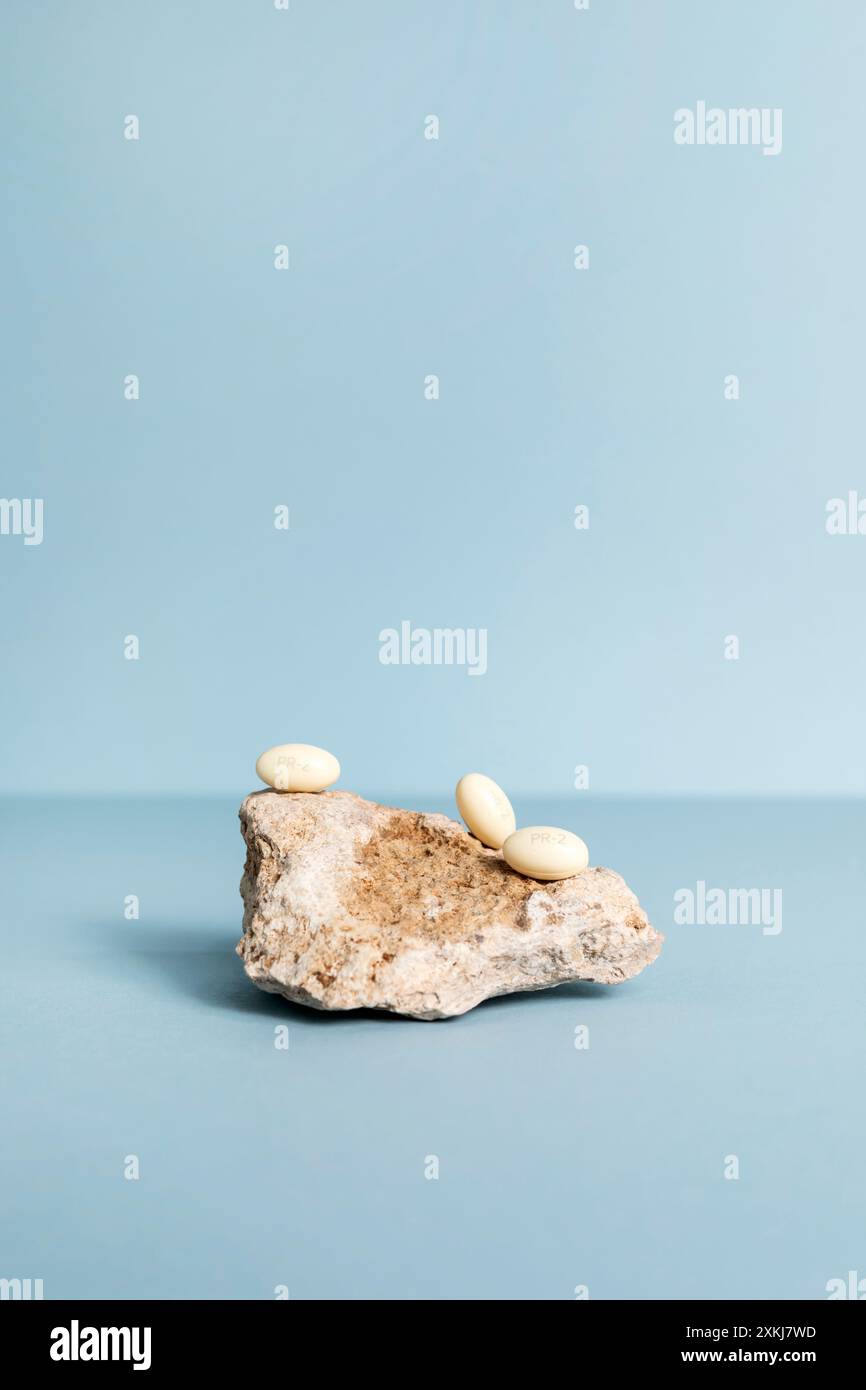 Progesterone Capsules On Stone, Blue Background. Natural Product ...