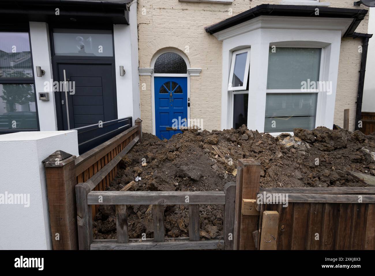 Builders leave a homeowners front garden overloaded with topsoil making ...