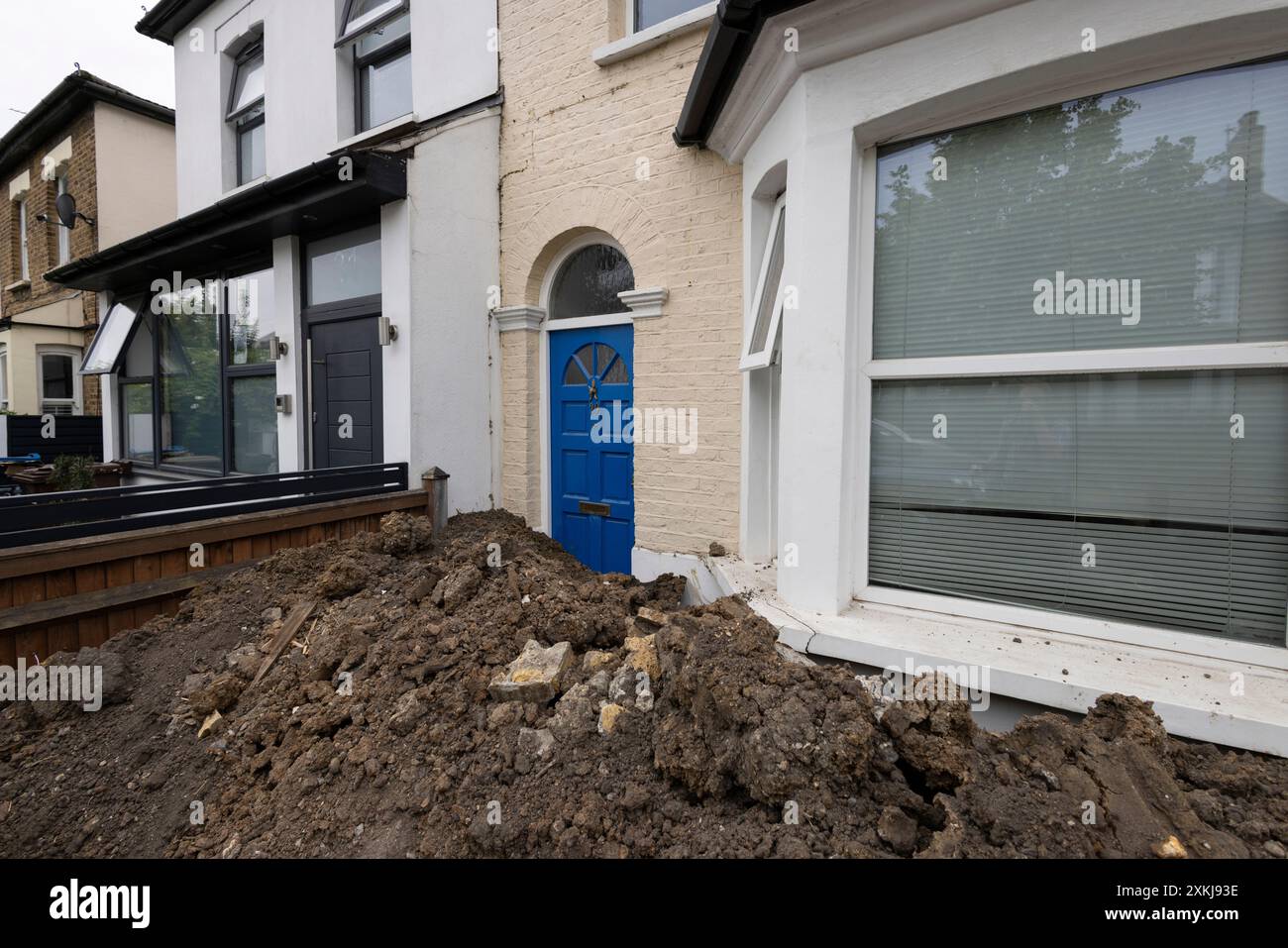Builders leave a homeowners front garden overloaded with topsoil making ...