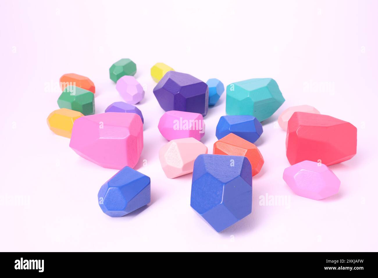 Many colorful balancing stones on white background Stock Photo - Alamy