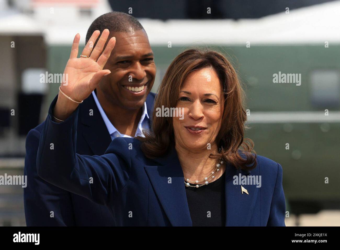 Vice President Kamala Harris waves before boarding Air Force Two as she ...