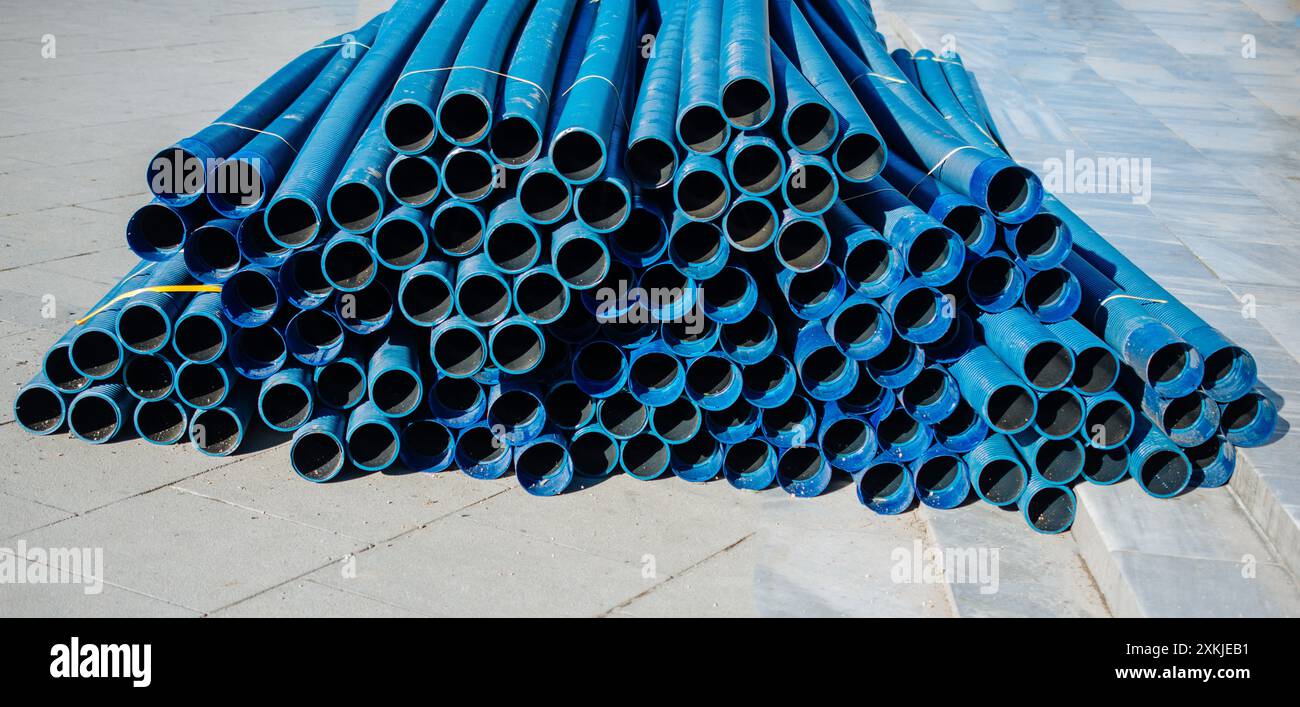 Dark blue color lue water pipes in view Stock Photo - Alamy
