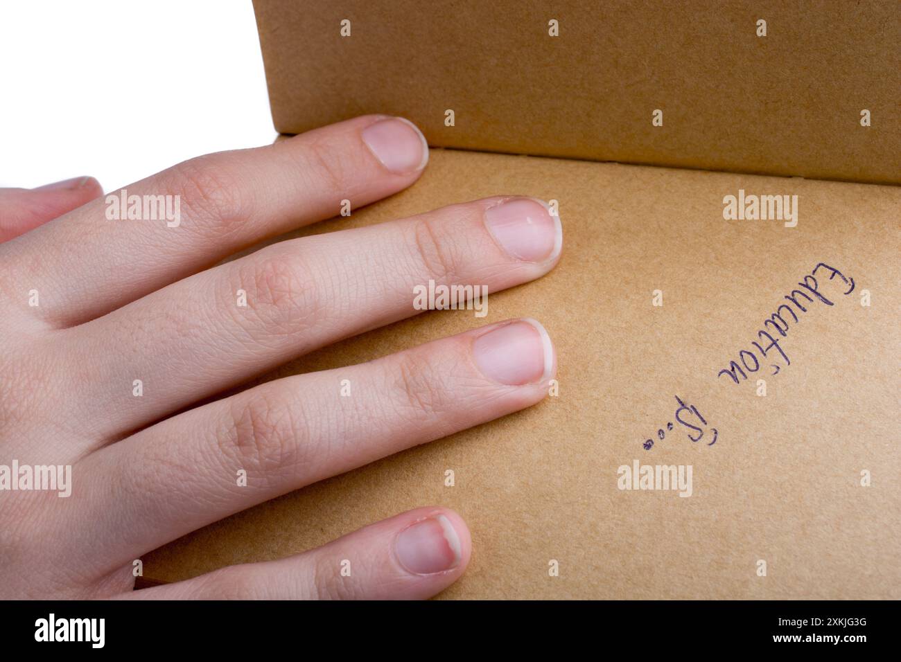 School pupil hand holding pencil hi-res stock photography and images ...