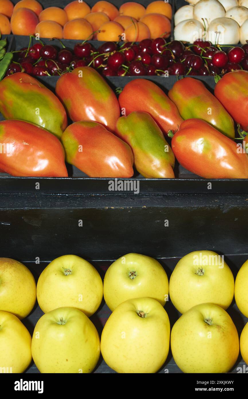 Fresh fruit lineup with dark red cherries, bicolor tomatoes, and bright ...