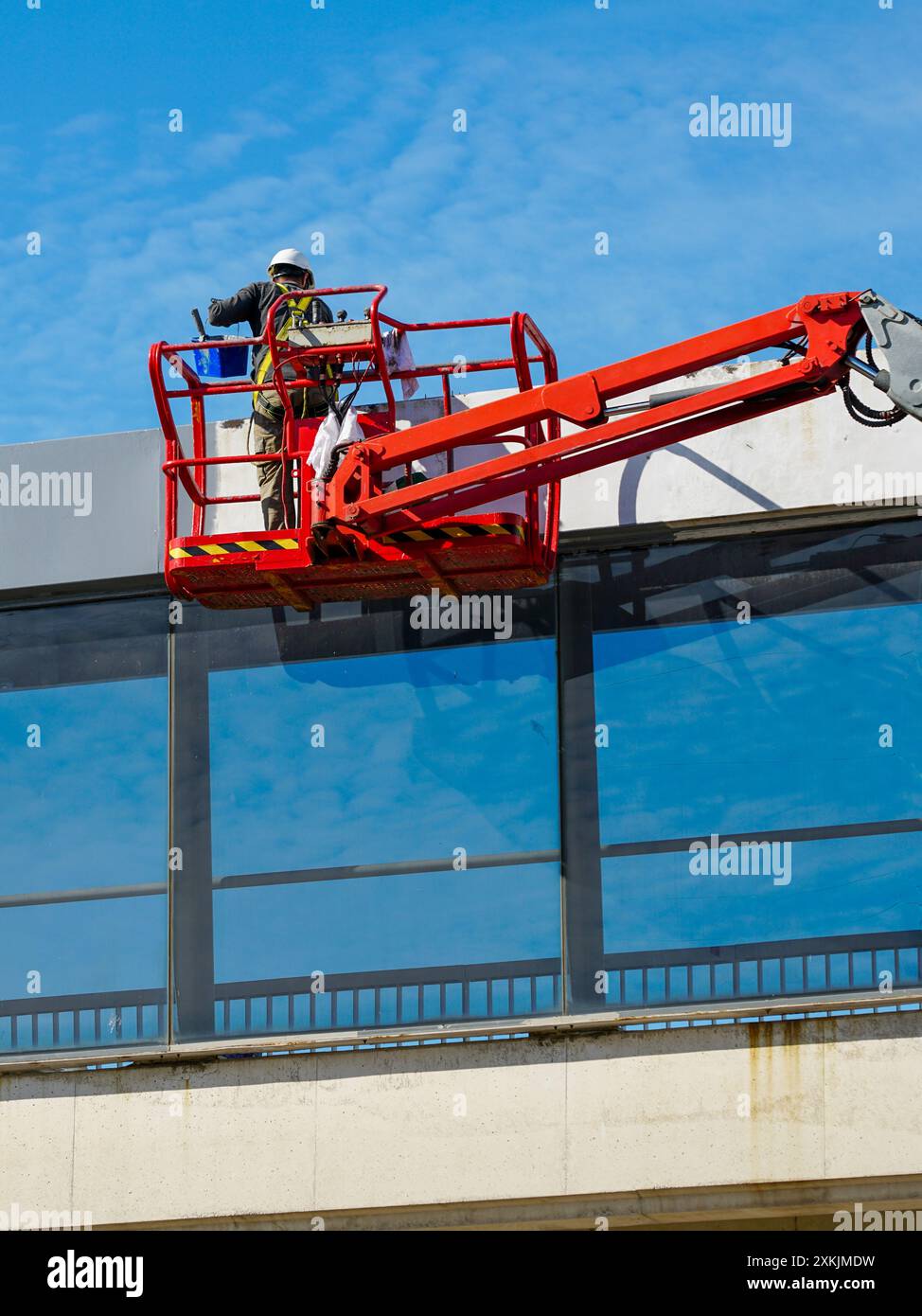 Elevated pedestrian overground tunnel facade painting using a ...