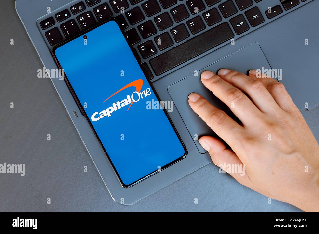 In this photo illustration, the Capital One logo is displayed on a ...