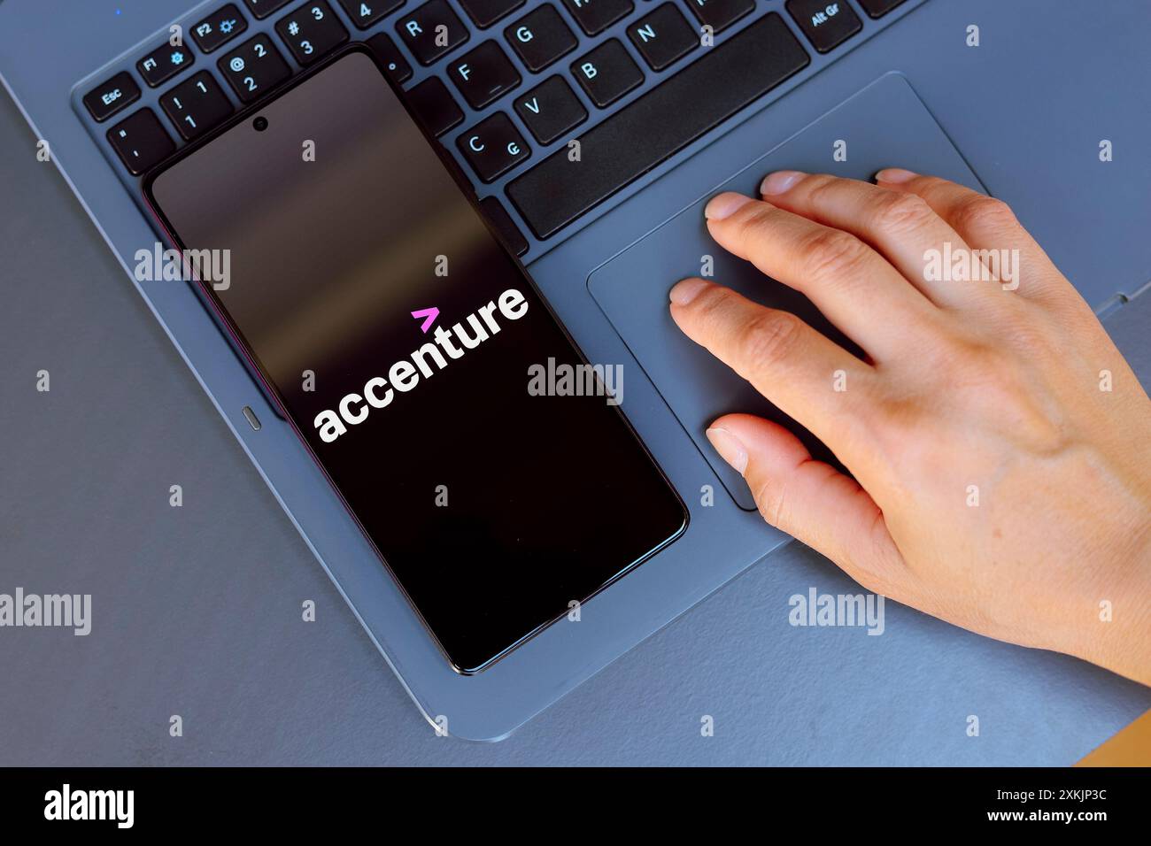 In this photo illustration, the Accenture logo is displayed on a ...