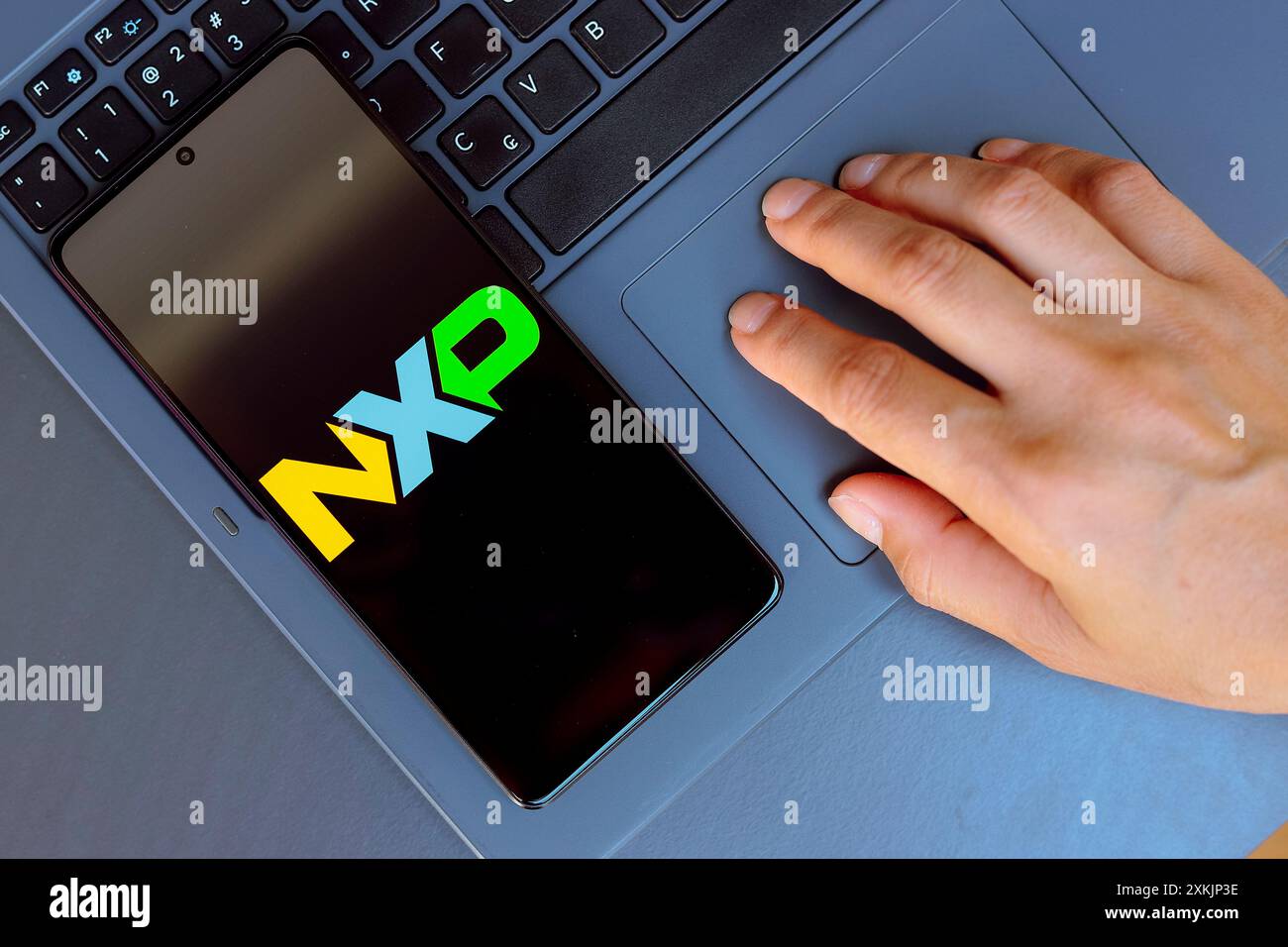 In this photo illustration, the NXP Semiconductors logo is displayed on ...