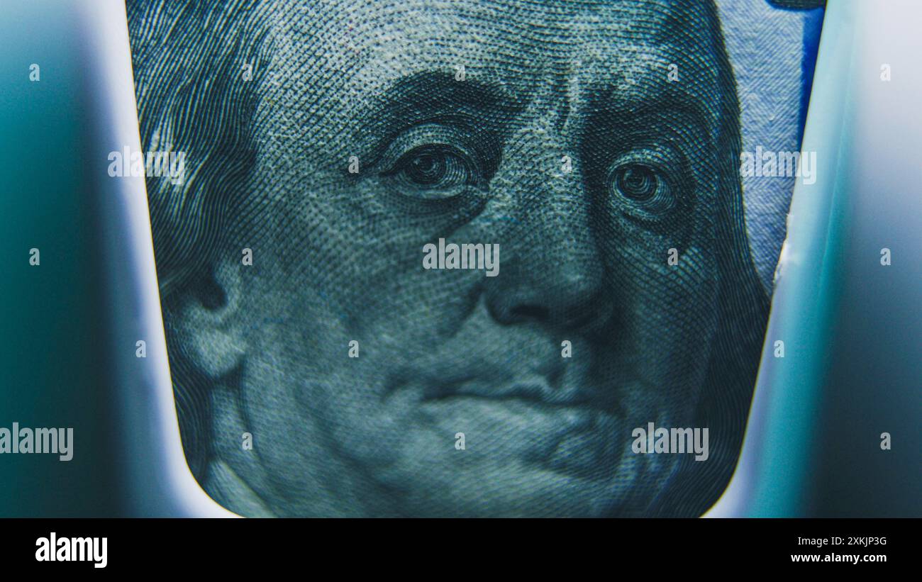 Bill counter counts hundred dollar banknotes for currency exchange. 100 ...