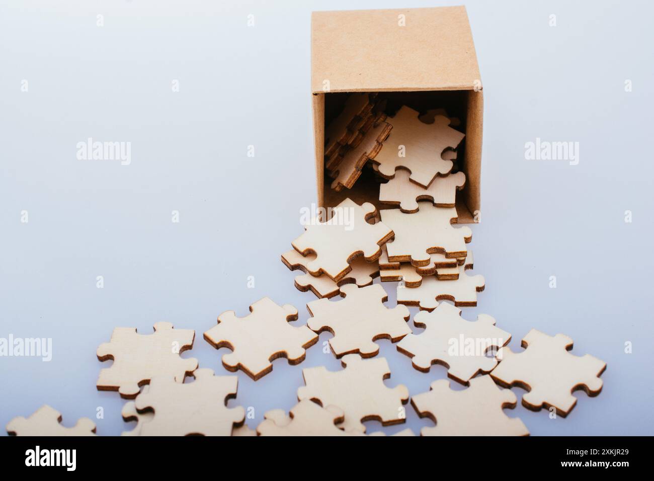 Pieces of jigsaw puzzle coming out of box as business solution concept ...