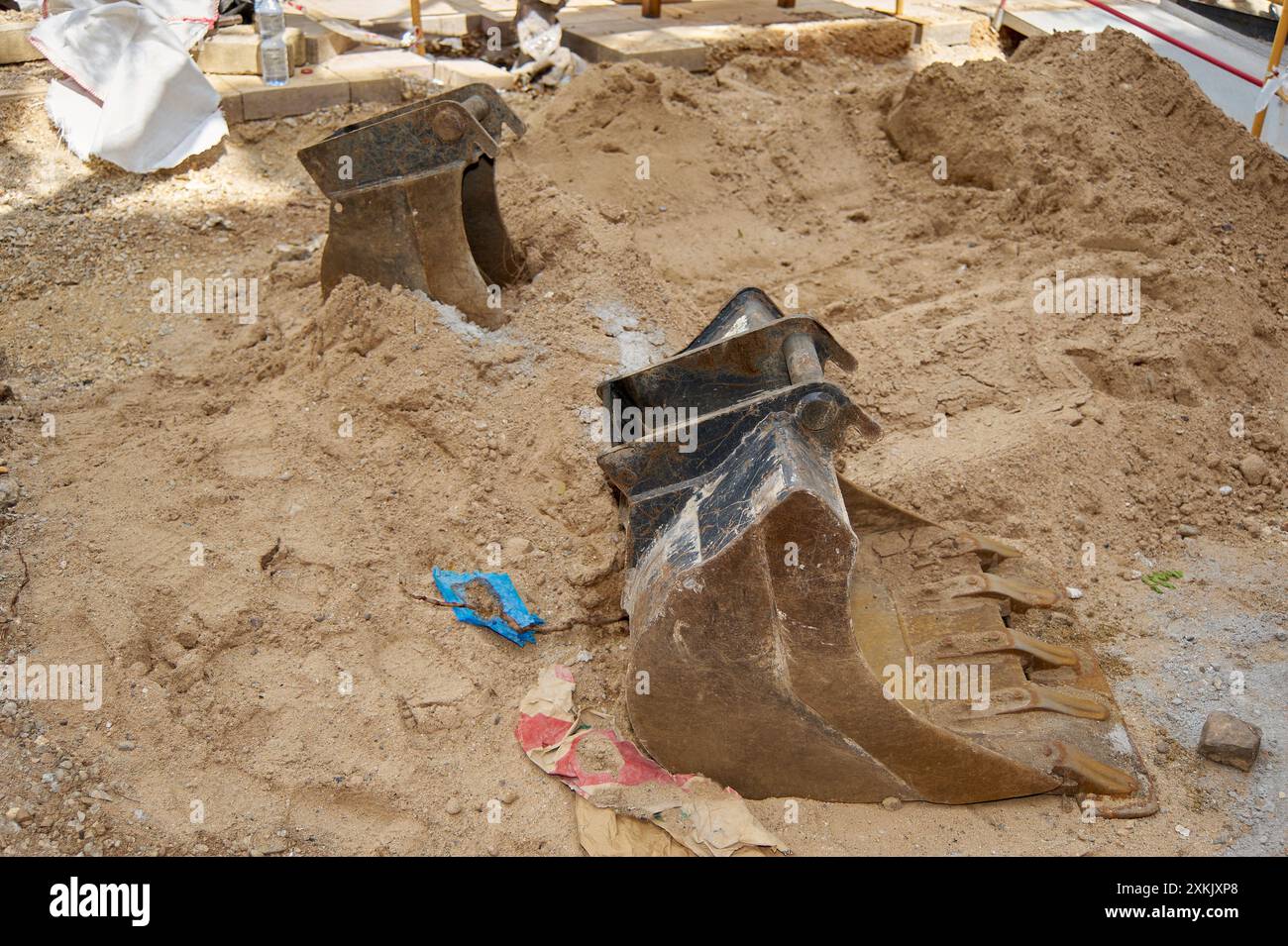 Image of heavy machinery at a construction site, showing two excavator ...