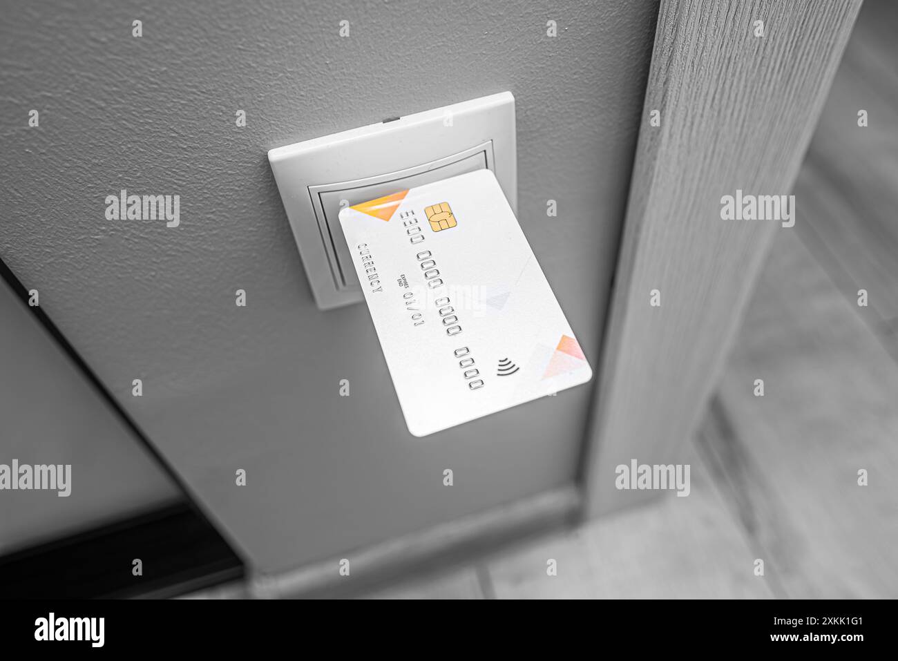 The credit card is charged from an electrical outlet Stock Photo - Alamy