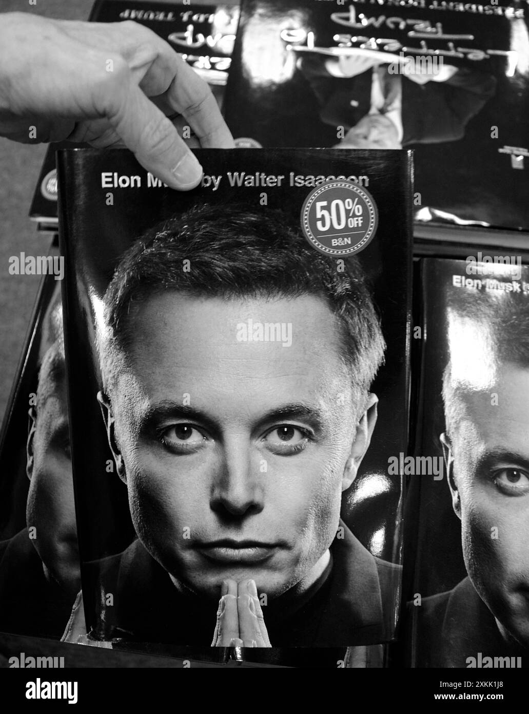 Copies of the biography of Elon Musk by Walter Issacson on a 50 percent ...