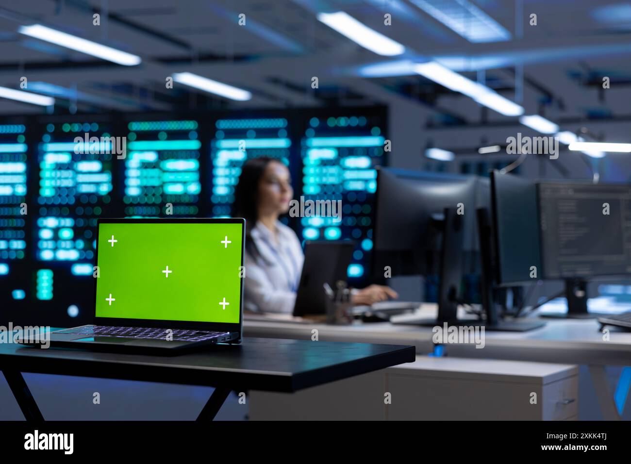 Focus on green screen laptop in data center facility managing ...