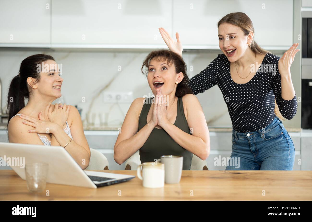 Women are sitting at computer and are immensely happy Stock Photo - Alamy