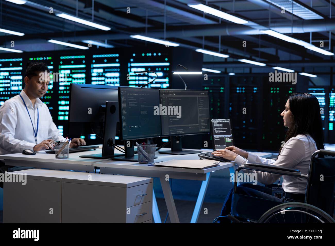 Person with disability and coworker in inclusive server room facility ensuring data remains ...