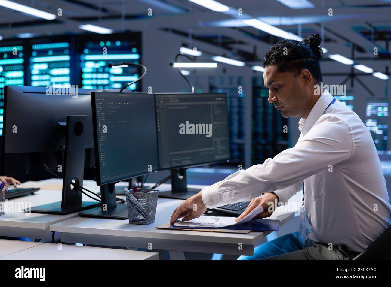 Engineer maintaining accurate documentation of data center infrastructure, configurations, and ...