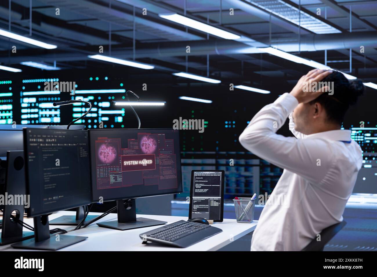 Hacker man trying breach security hi-res stock photography and images ...